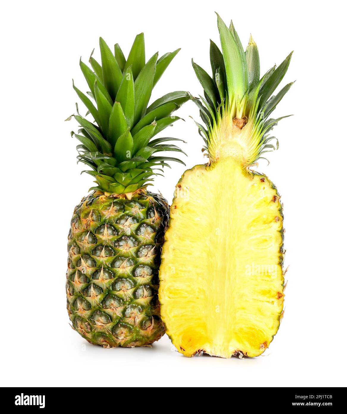 Halves of fresh cut pineapple on white background Stock Photo - Alamy
