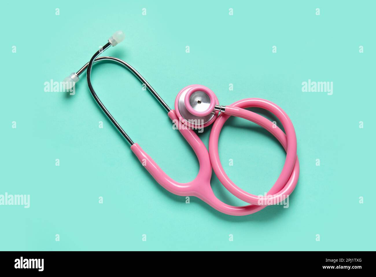 Modern stethoscope on turquoise background Stock Photo - Alamy