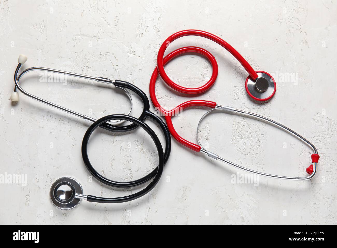 Modern stethoscopes on light background Stock Photo - Alamy