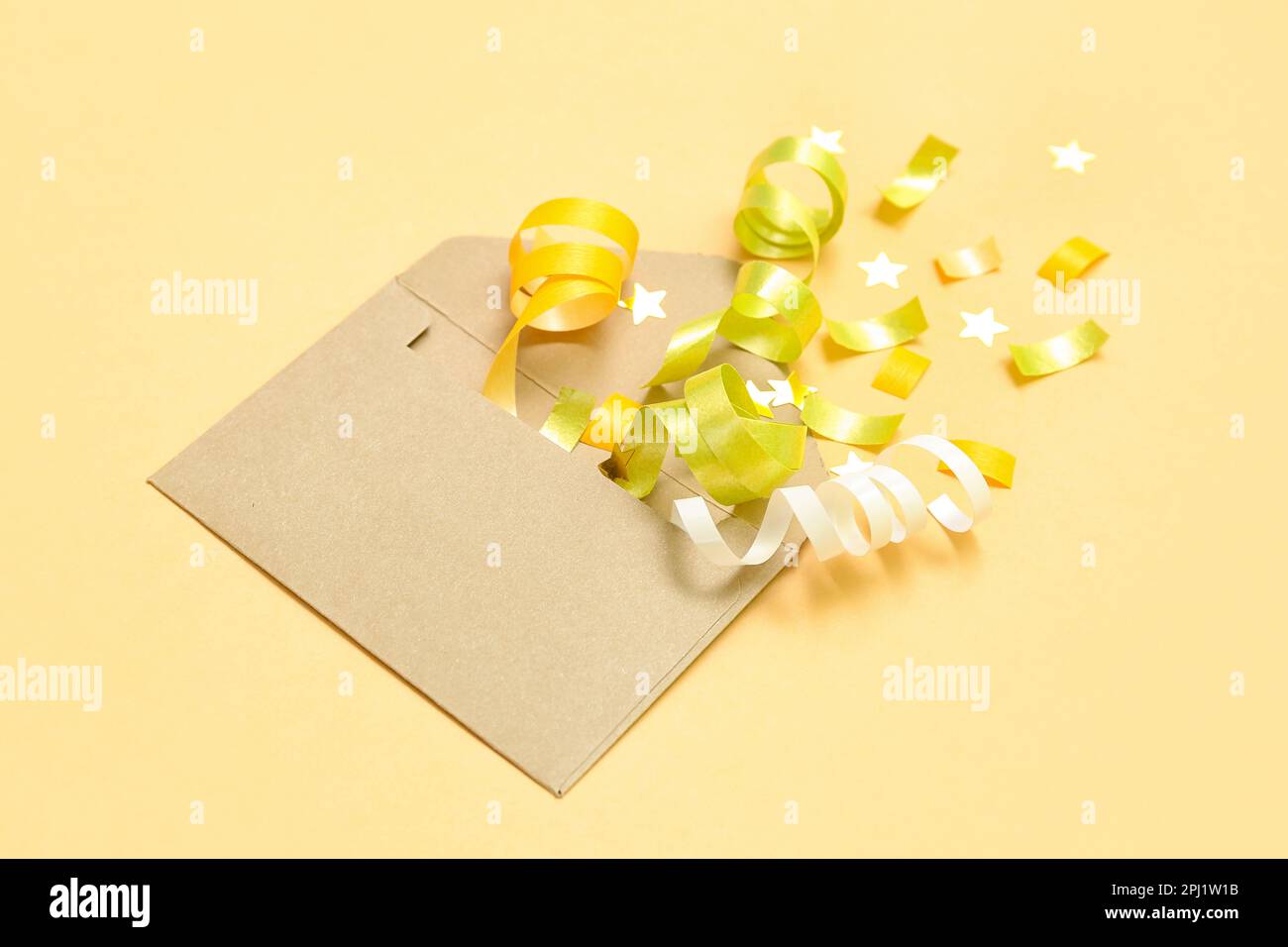 Composition with envelope and confetti on yellow background Stock Photo ...