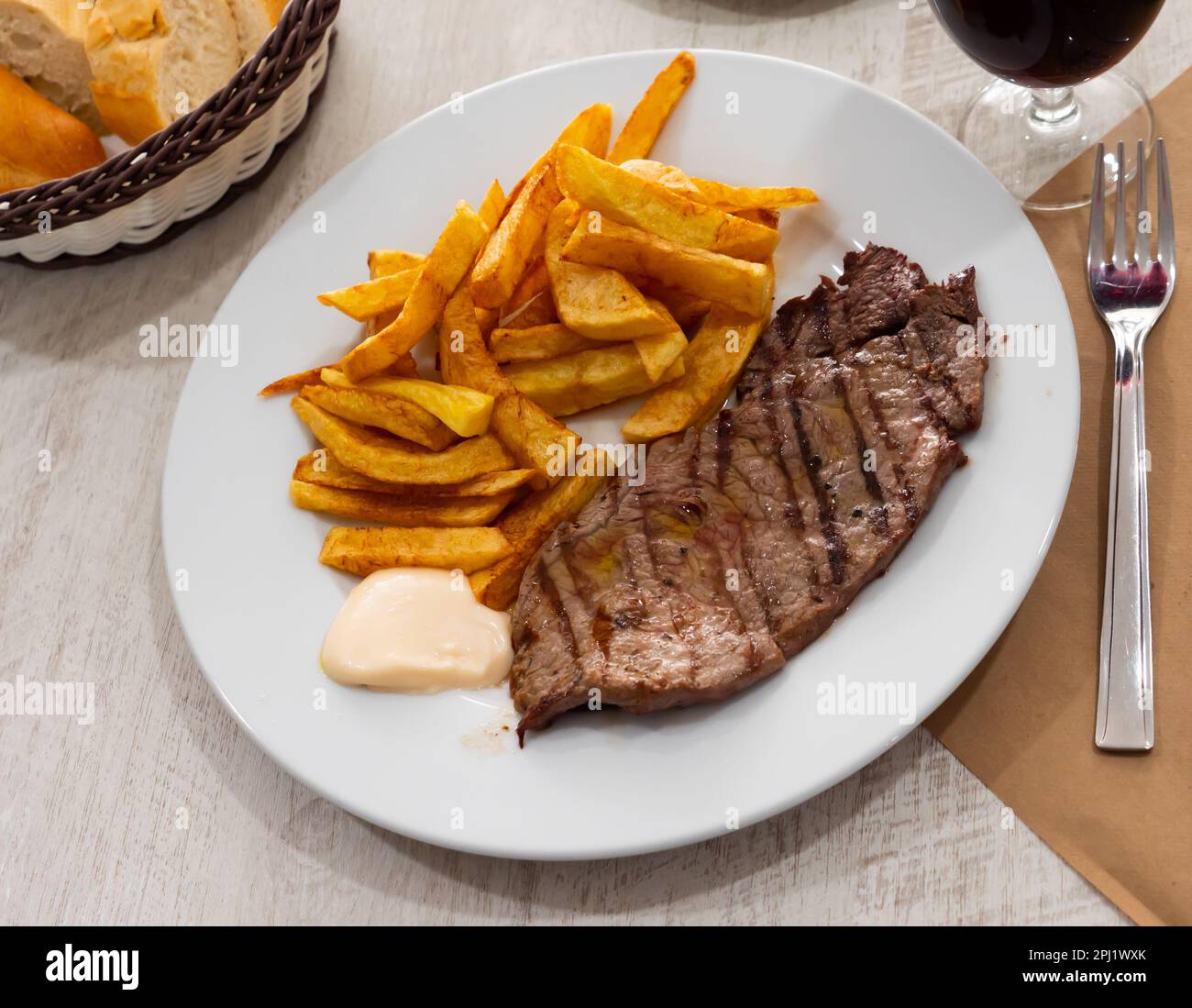 Delicious grilled beef with French fries Stock Photo - Alamy