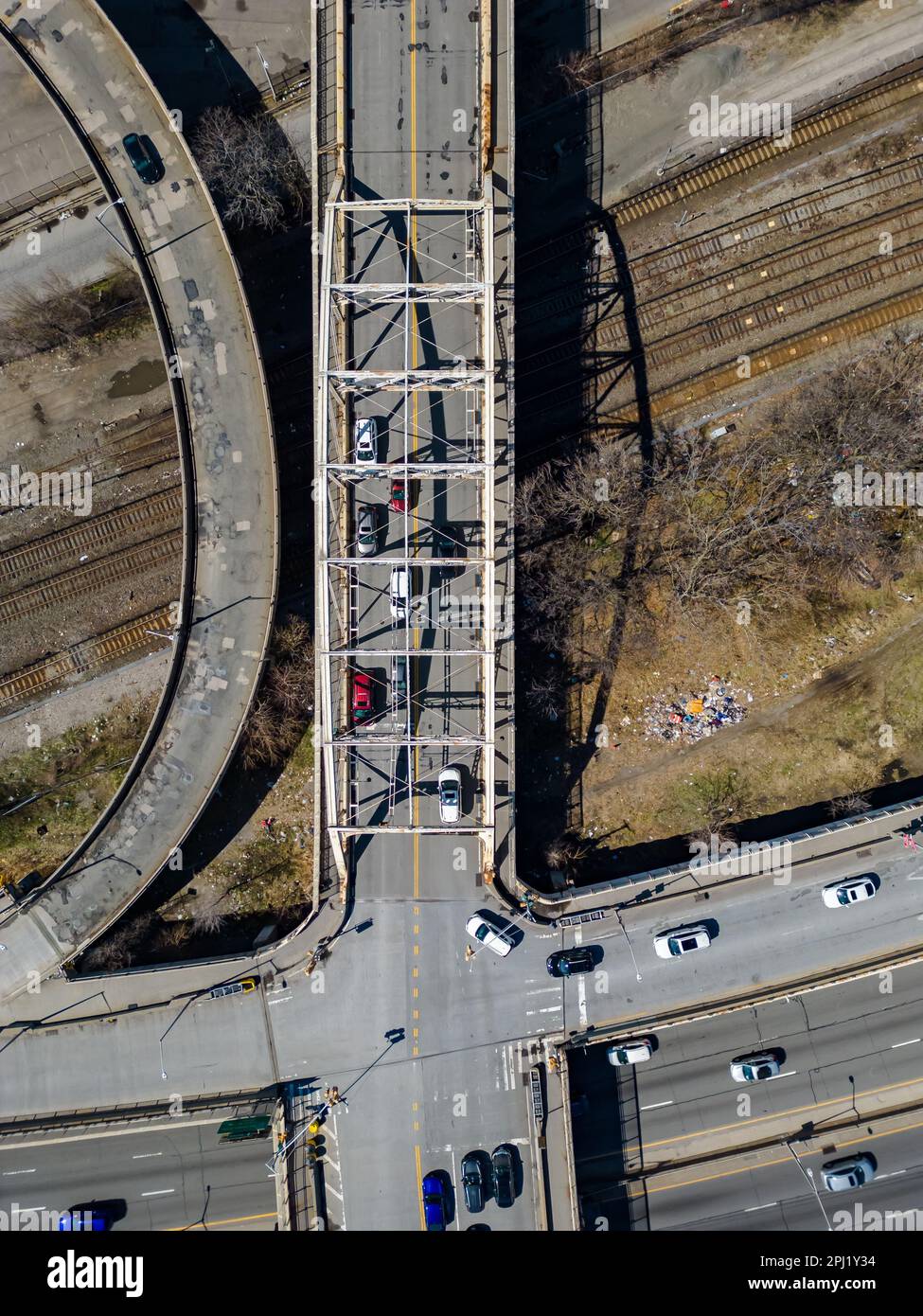 An aerial view of a bustling cityscape featuring a bridge, with ...
