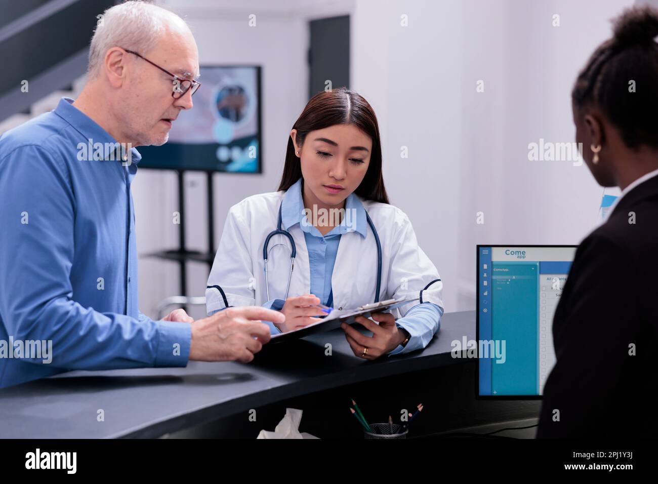 Physician doctor showing medical expertise to senior patient discussing ...