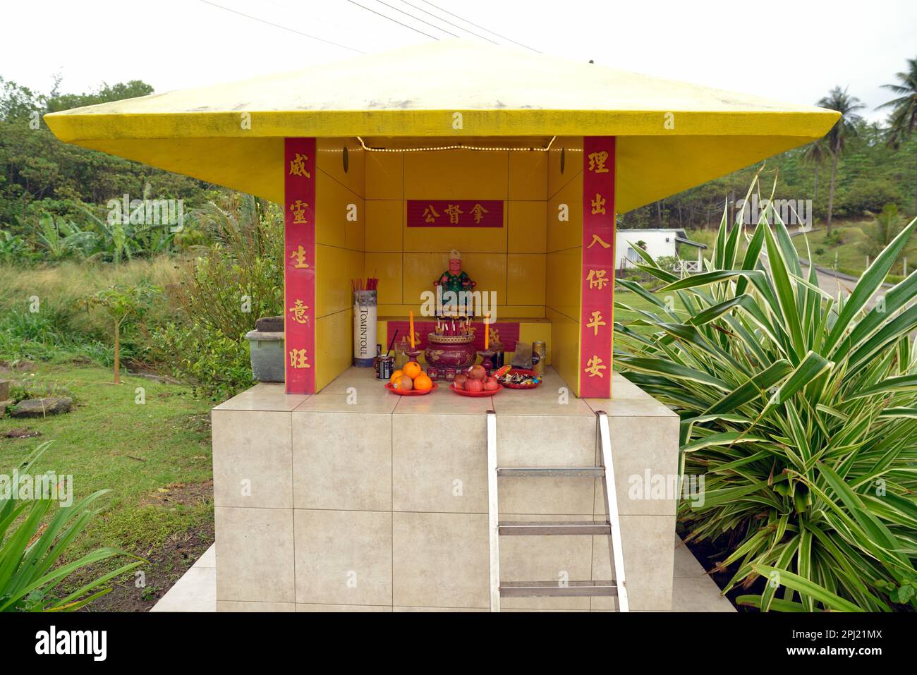 Offerings of food and drinks left at a shrine. Tip of Borneo, Malaysia ...