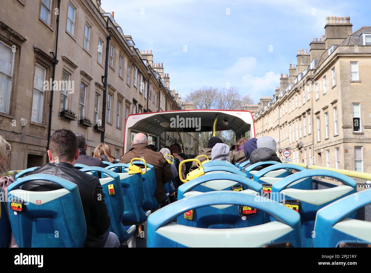 PASSENGERS ONBOARD AN OPEN TOP SIGHTSEEING TOUR BUS IN THE CITY OF BATH ...