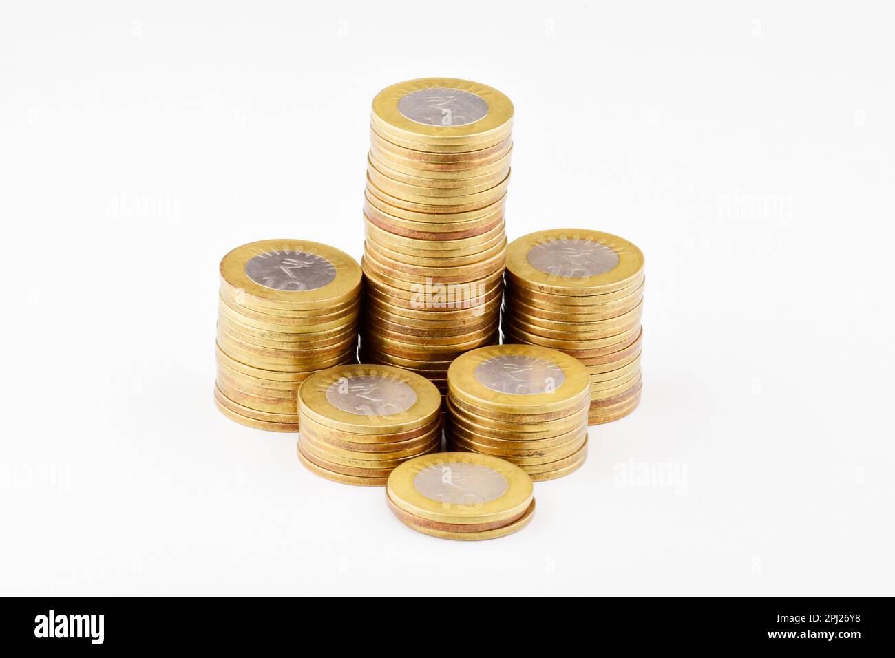 Ten rupees coin pile isolated on white background with clipping path ...
