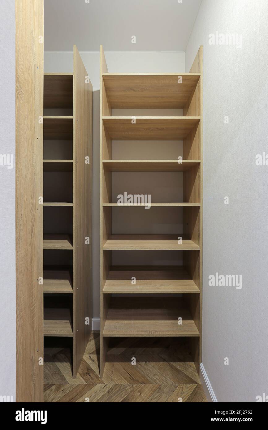 Open wardrobe with shelves in the dressing room Stock Photo - Alamy