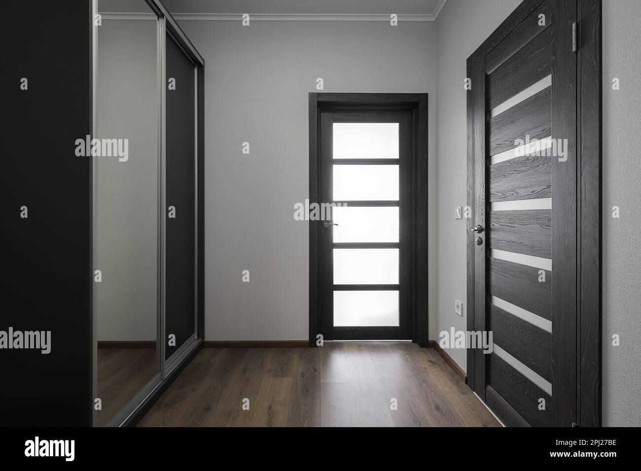 Dark interior doors with glass in the apartment interior Stock Photo ...