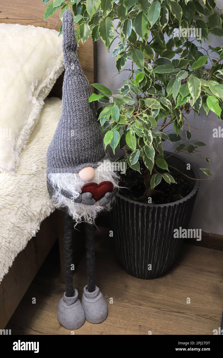 Gnome toy near the bed inside the home Stock Photo - Alamy