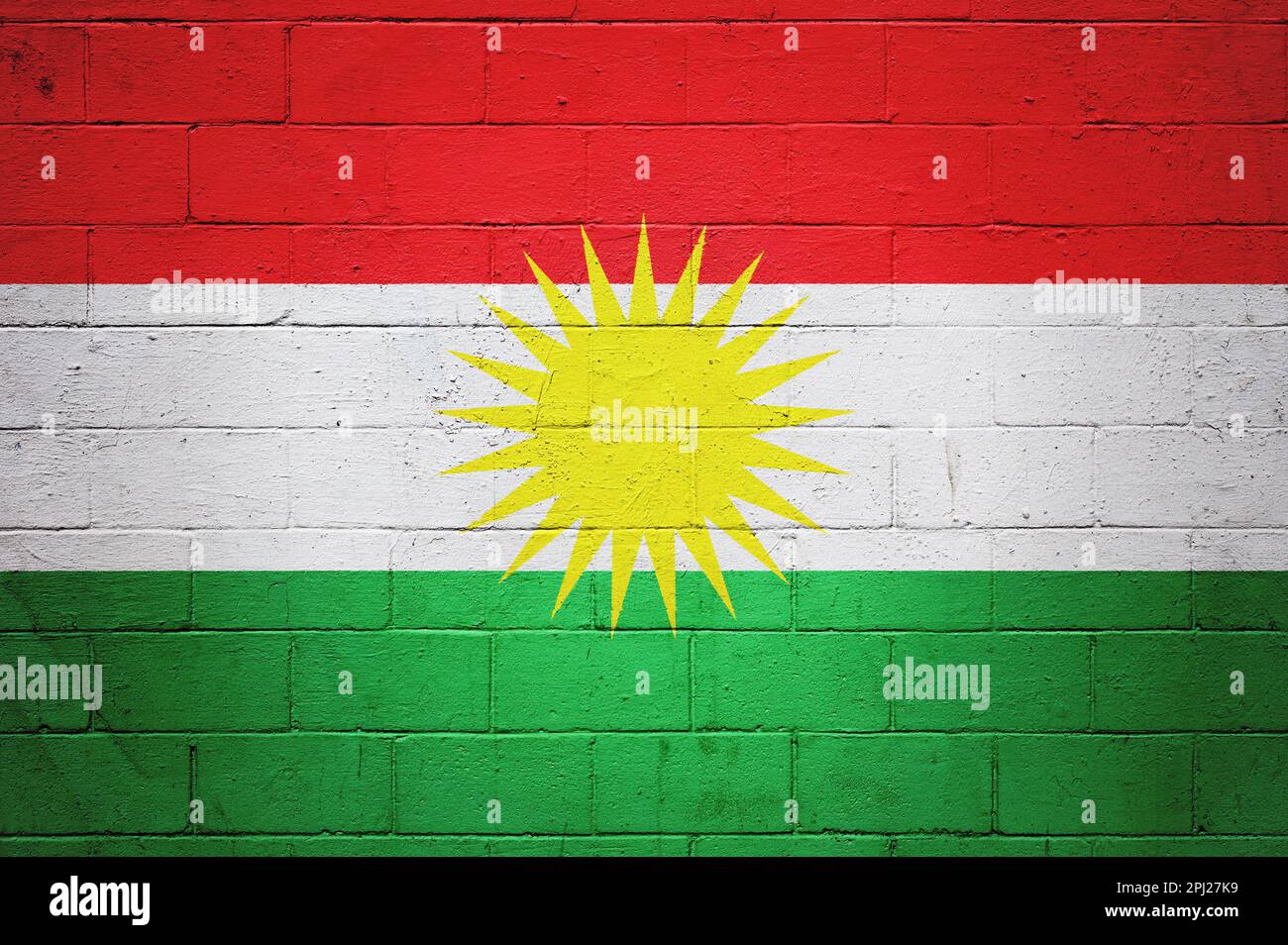 Flag of Kurdistan painted on a cinder block wall Stock Photo - Alamy