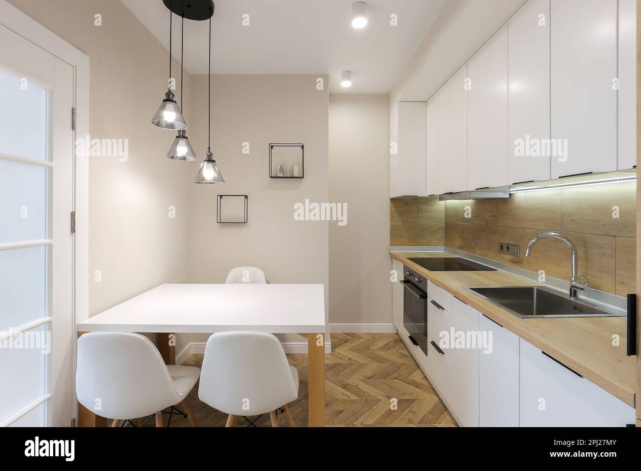 Dining table in the modern kitchen interior Stock Photo - Alamy