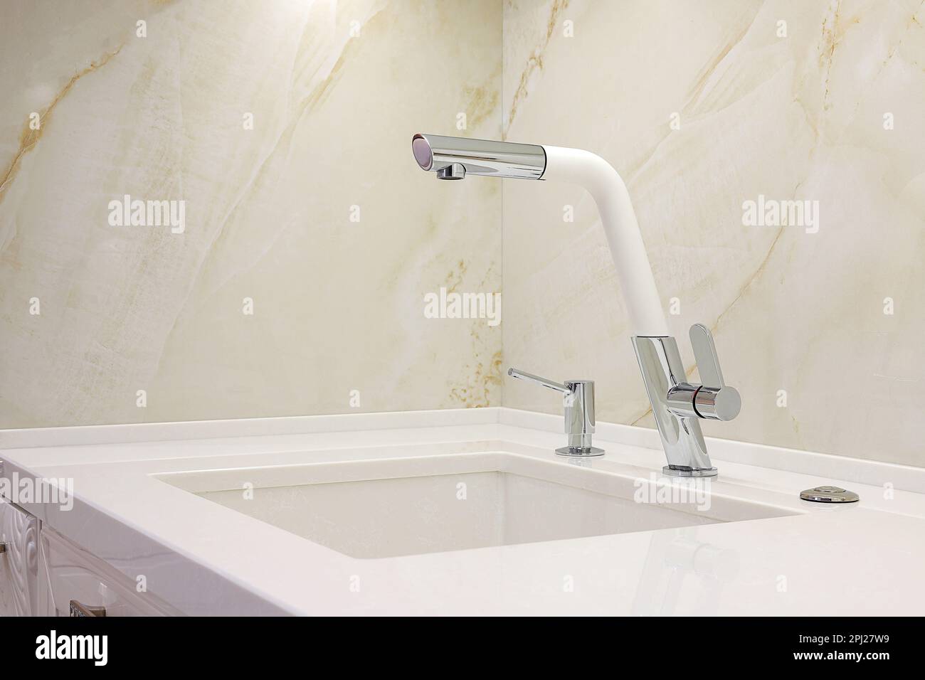 Faucet and granite sink close-up in the kitchen Stock Photo - Alamy