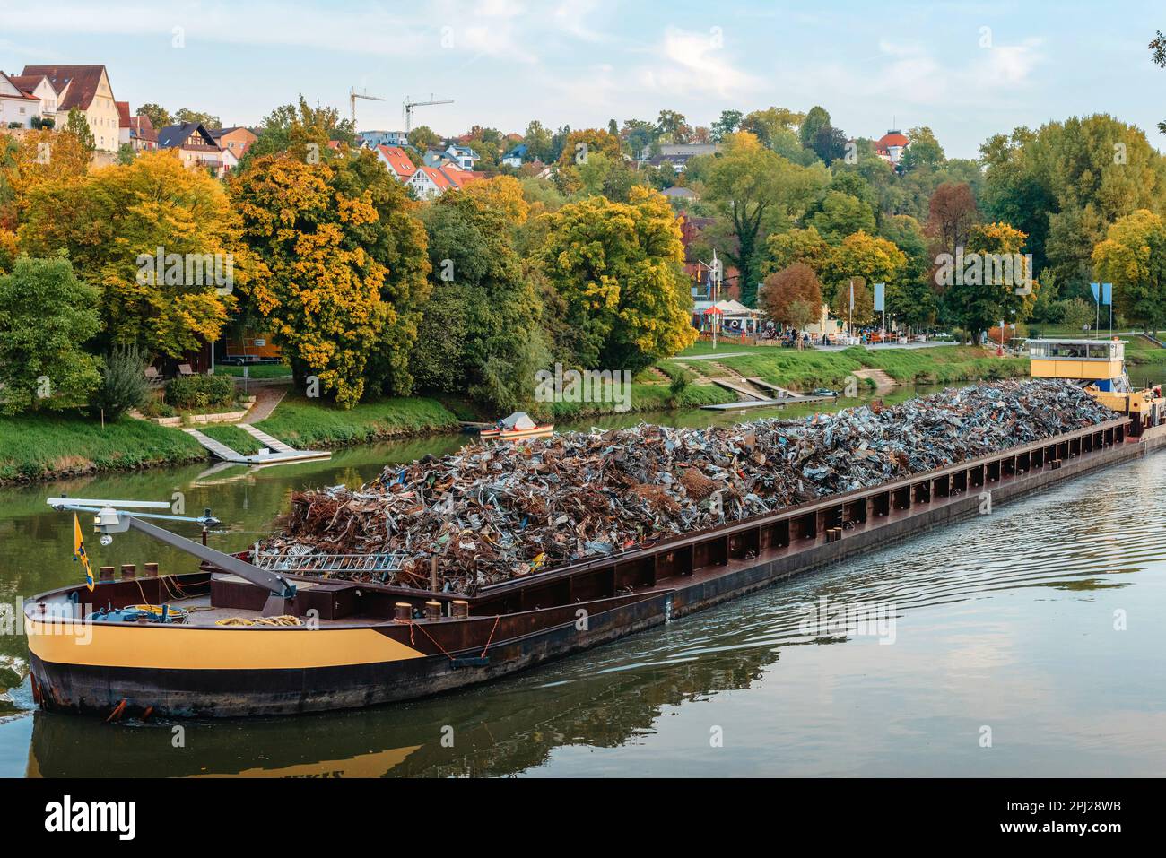 Transportation industry. Ship barge transports scrap metal and sand ...