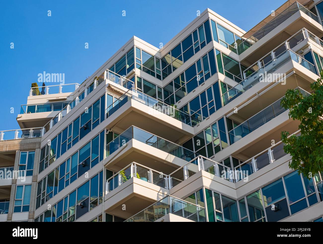 Modern apartment buildings exteriors in sunny day. Cityscape with ...