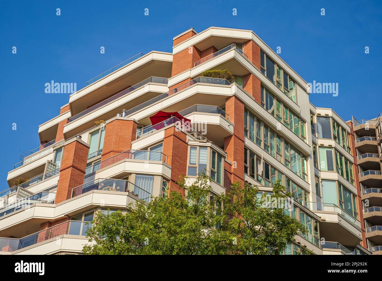 Modern apartment buildings exteriors in sunny day. Cityscape with ...