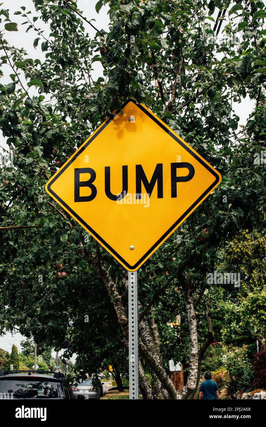 yellow road sign with "bump Stock Photo - Alamy
