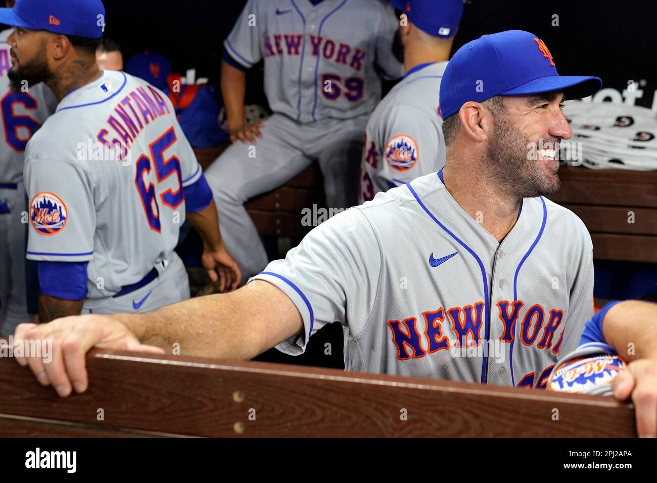 New York Mets pitcher Justin Verlander smiles in the dugout before an opening day baseball game ...