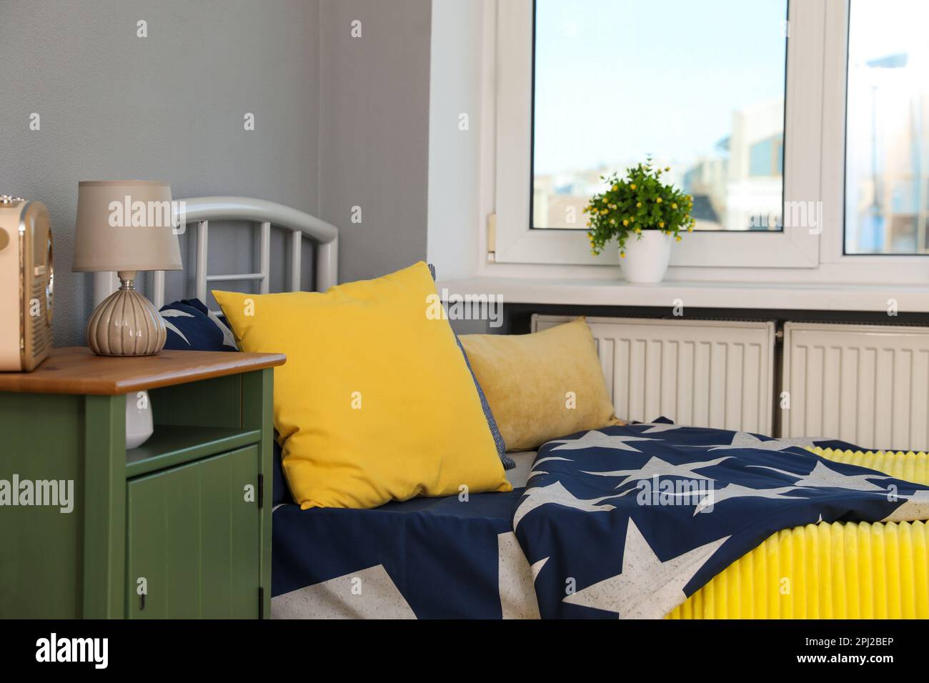 Stylish child room interior with comfortable bed near window Stock ...