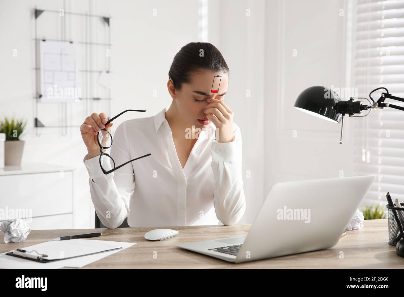 Illustration of discharged battery and tired woman at workplace in ...