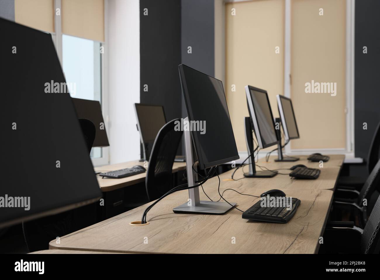 Rows of computers in empty office hi-res stock photography and images ...