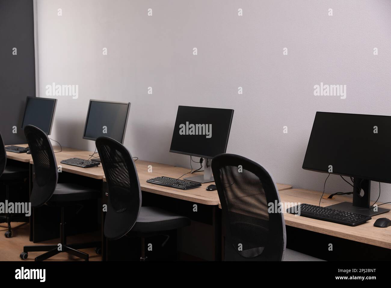 Many modern computers in open space office Stock Photo - Alamy