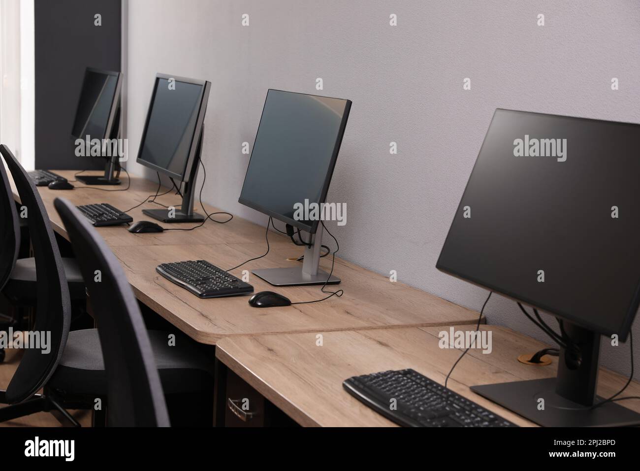 Many modern computers in open space office Stock Photo - Alamy