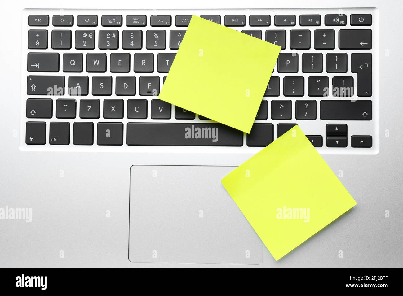 Empty sticky notes on laptop, top view. Space for design Stock Photo ...