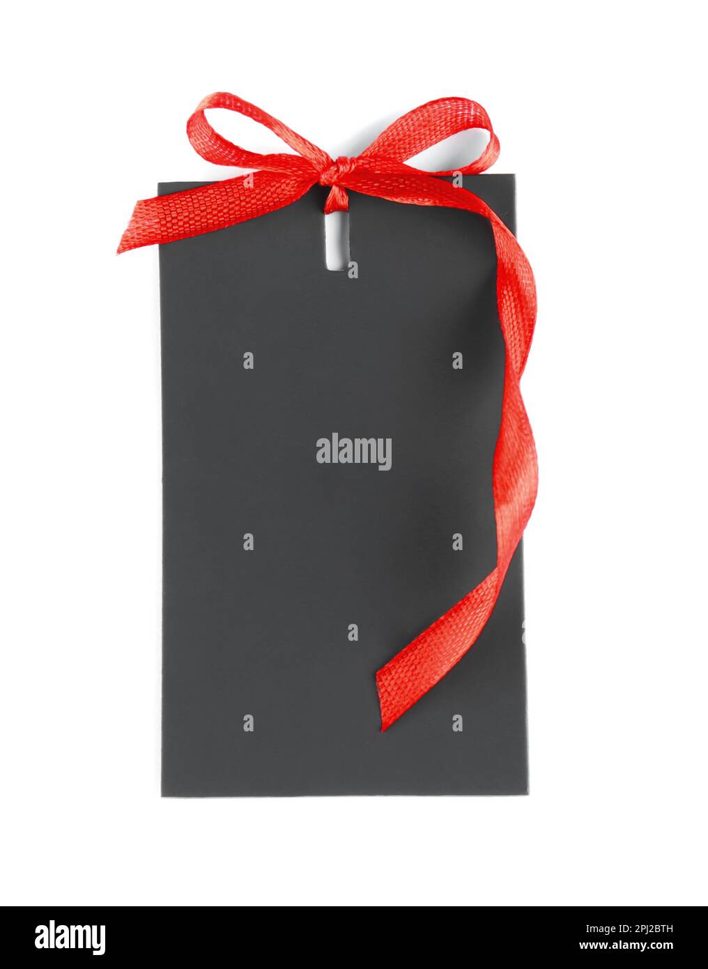 Blank black gift tag with red satin ribbon on white background, top ...