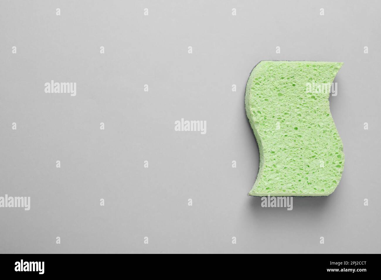 New sponge on light grey background, top view. Space for text Stock ...