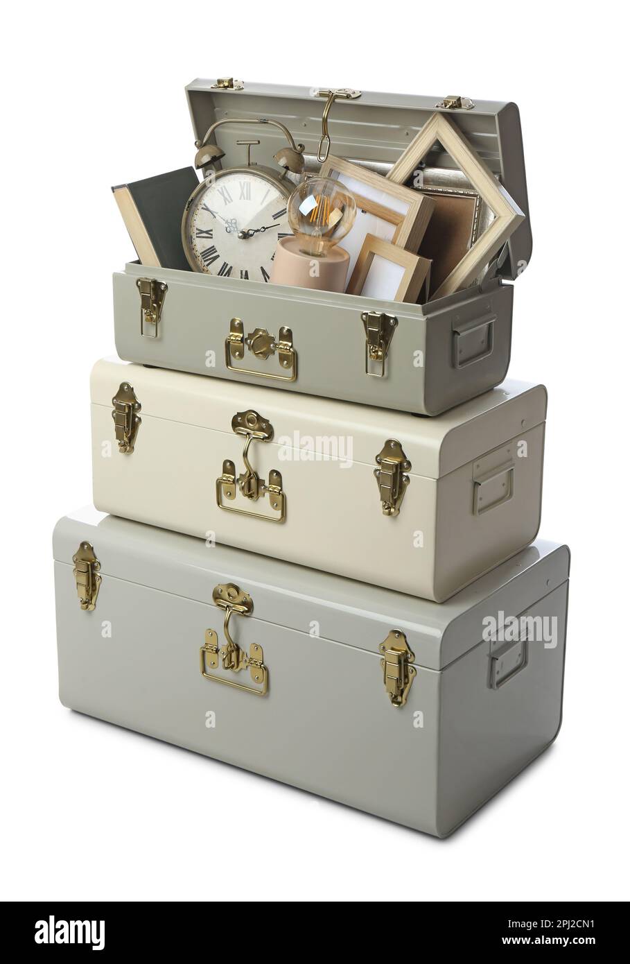 Stylish storage trunks with different interior elements on white ...
