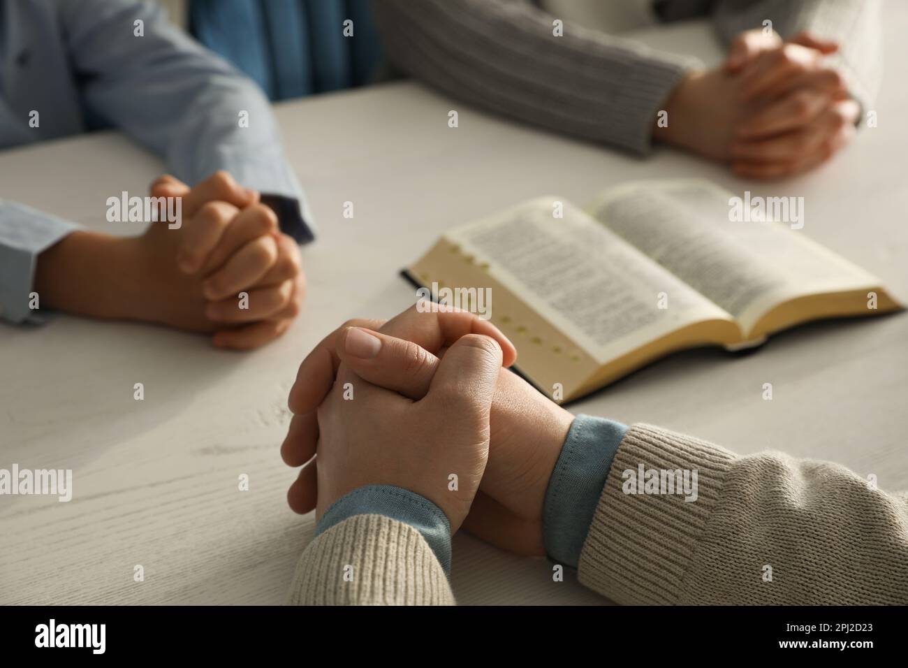Boy godparents praying together hi-res stock photography and images - Alamy