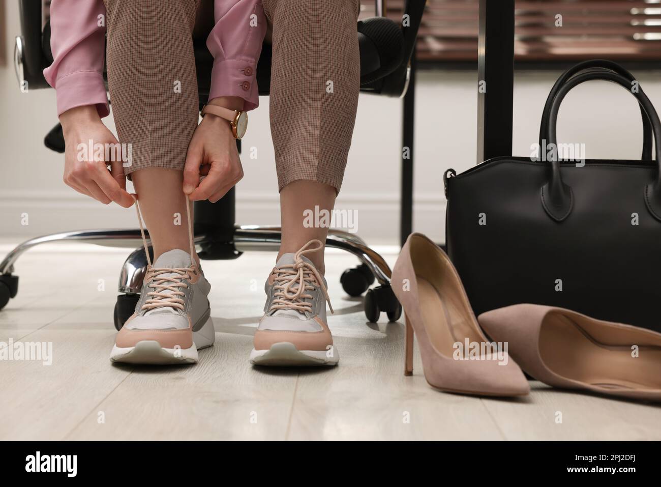 Woman changing shoes at workplace in office, closeup Stock Photo - Alamy