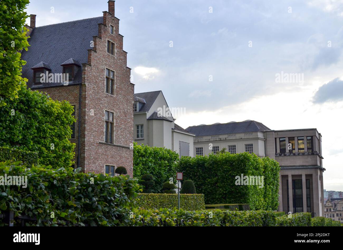 Picturesque view of town with beautiful buildings and green plants ...