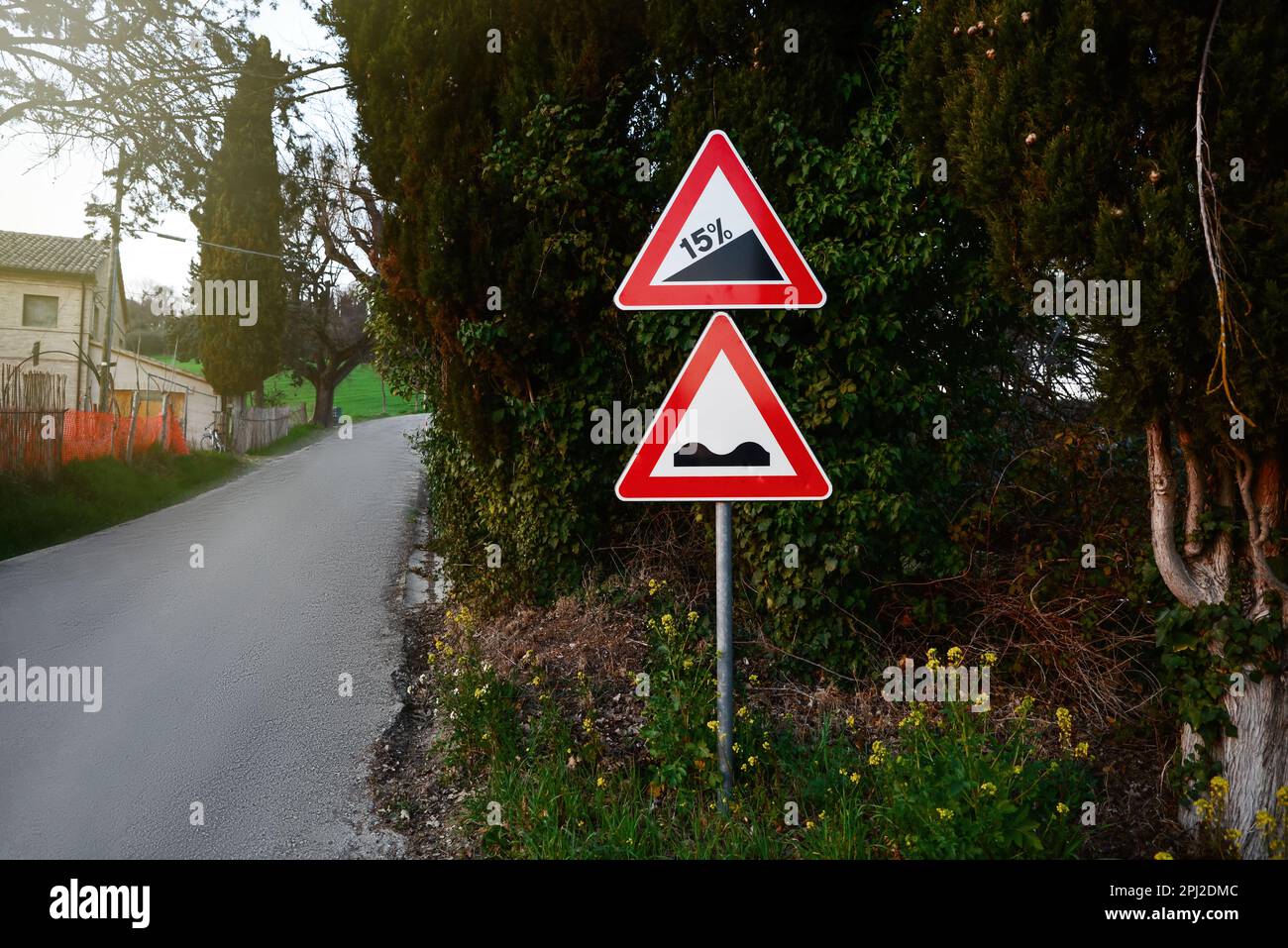 Traffic signs STEEP HILL UPWARDS and UNEVEN ROAD outdoors Stock Photo ...