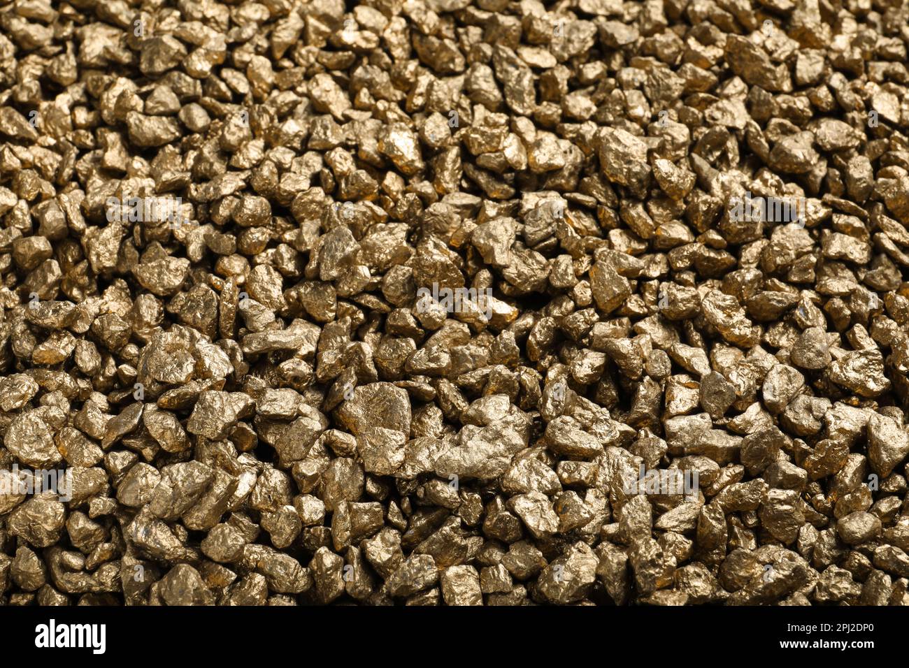 Pile of gold nuggets as background, closeup Stock Photo - Alamy