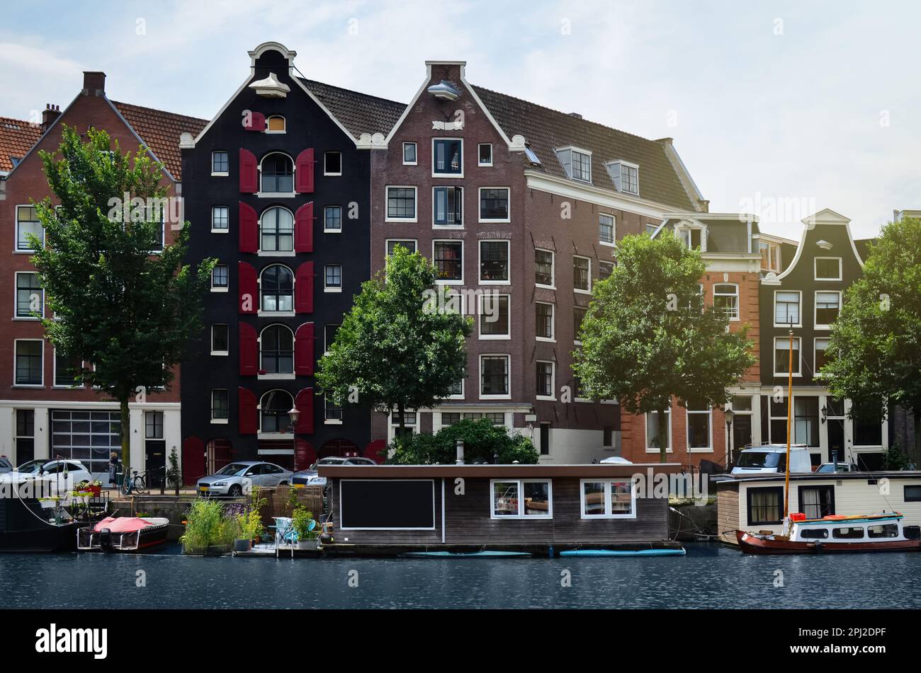 Picturesque view of town with beautiful buildings near river Stock ...