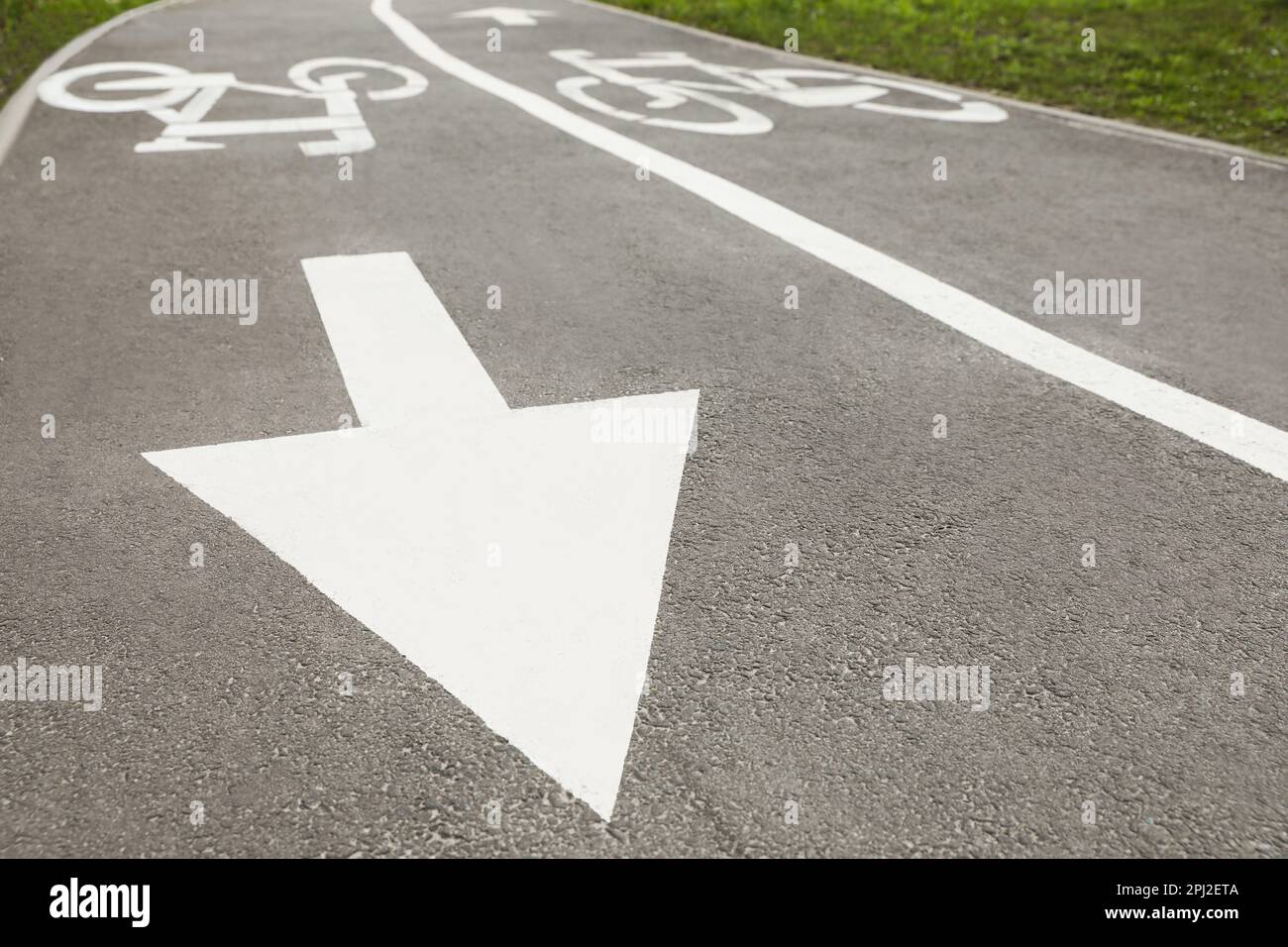Two way bicycle lane with white markings on asphalt Stock Photo - Alamy