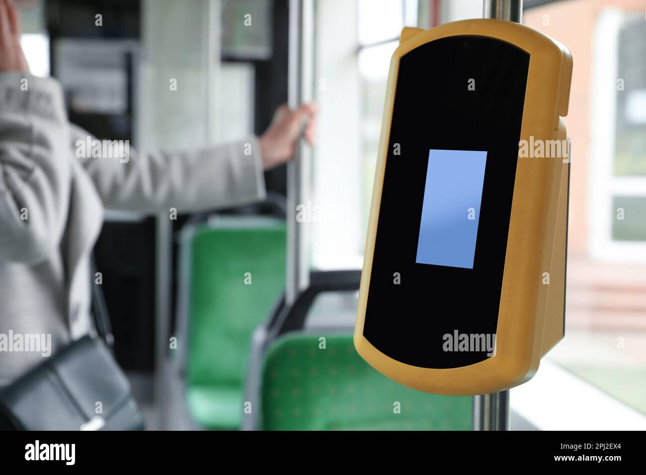 Contactless fare payment device in public transport, space for text ...