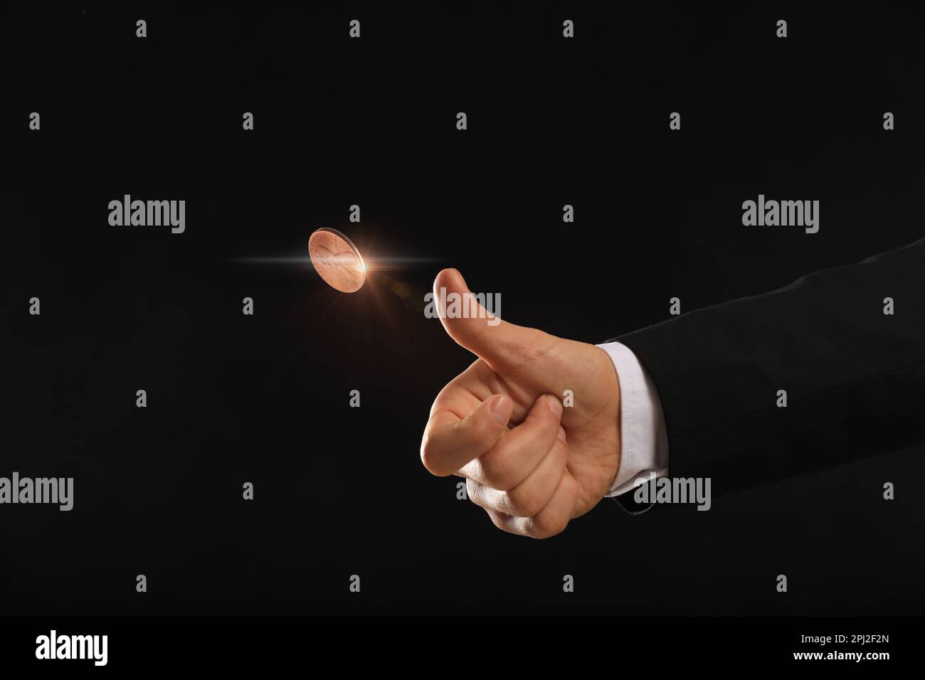 Man throwing coin on black background, closeup. Making decision Stock ...