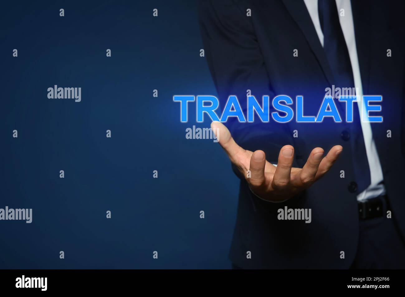 Man showing virtual model of word TRANSLATE against dark blue ...