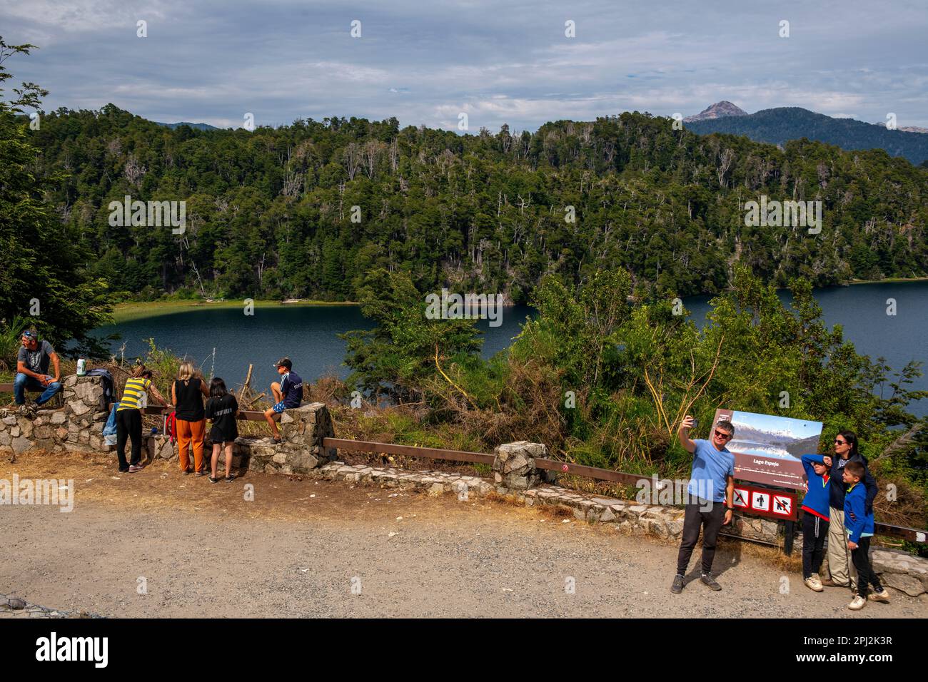 Tourists on the Lookout point at Lake Espejo (Mirror) on Lanin National ...