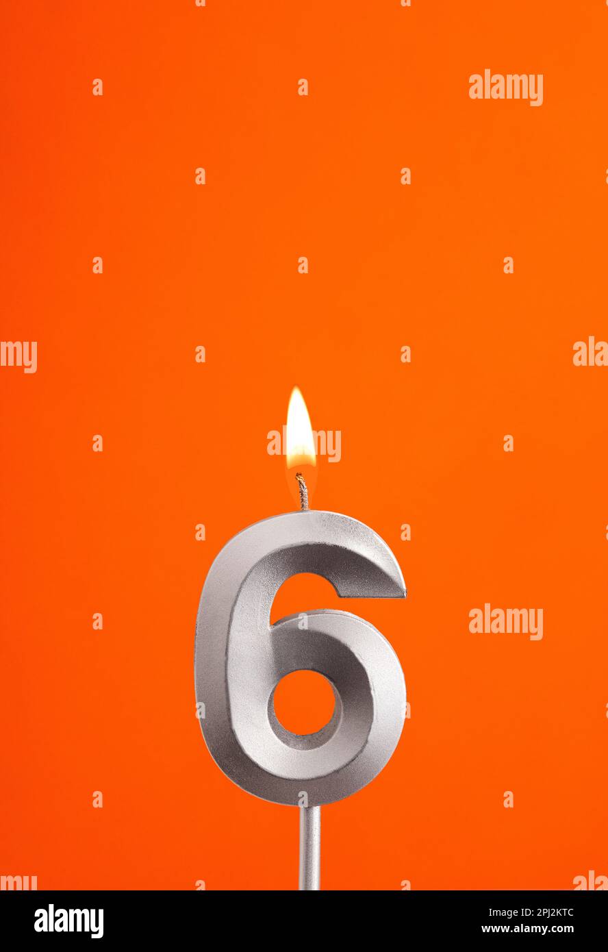 Candle number 6 - Birthday in orange foamy background Stock Photo - Alamy