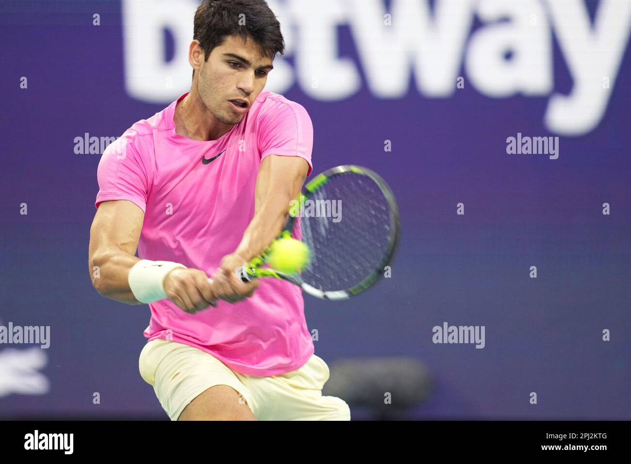 Carlos Alcaraz, of Spain, returns a volley against Taylor Fritz, of the ...