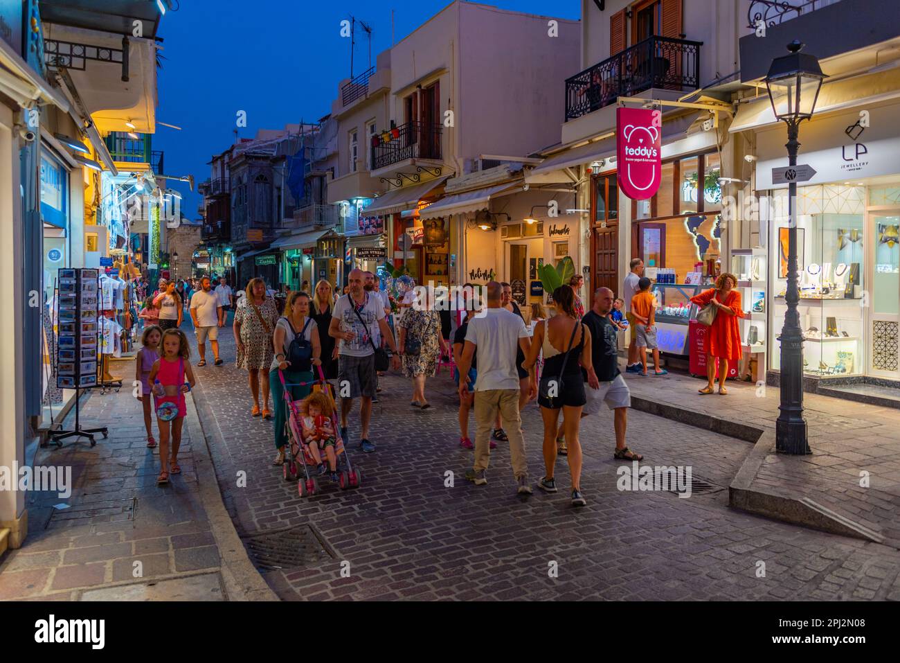 Rethimno, Greece, August 20, 2022: Sunset view of people strolling at a ...