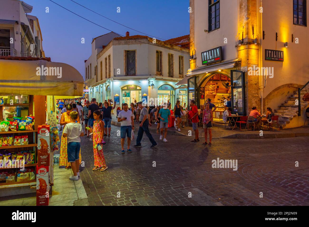 Rethimno, Greece, August 20, 2022: Sunset view of people strolling at a ...