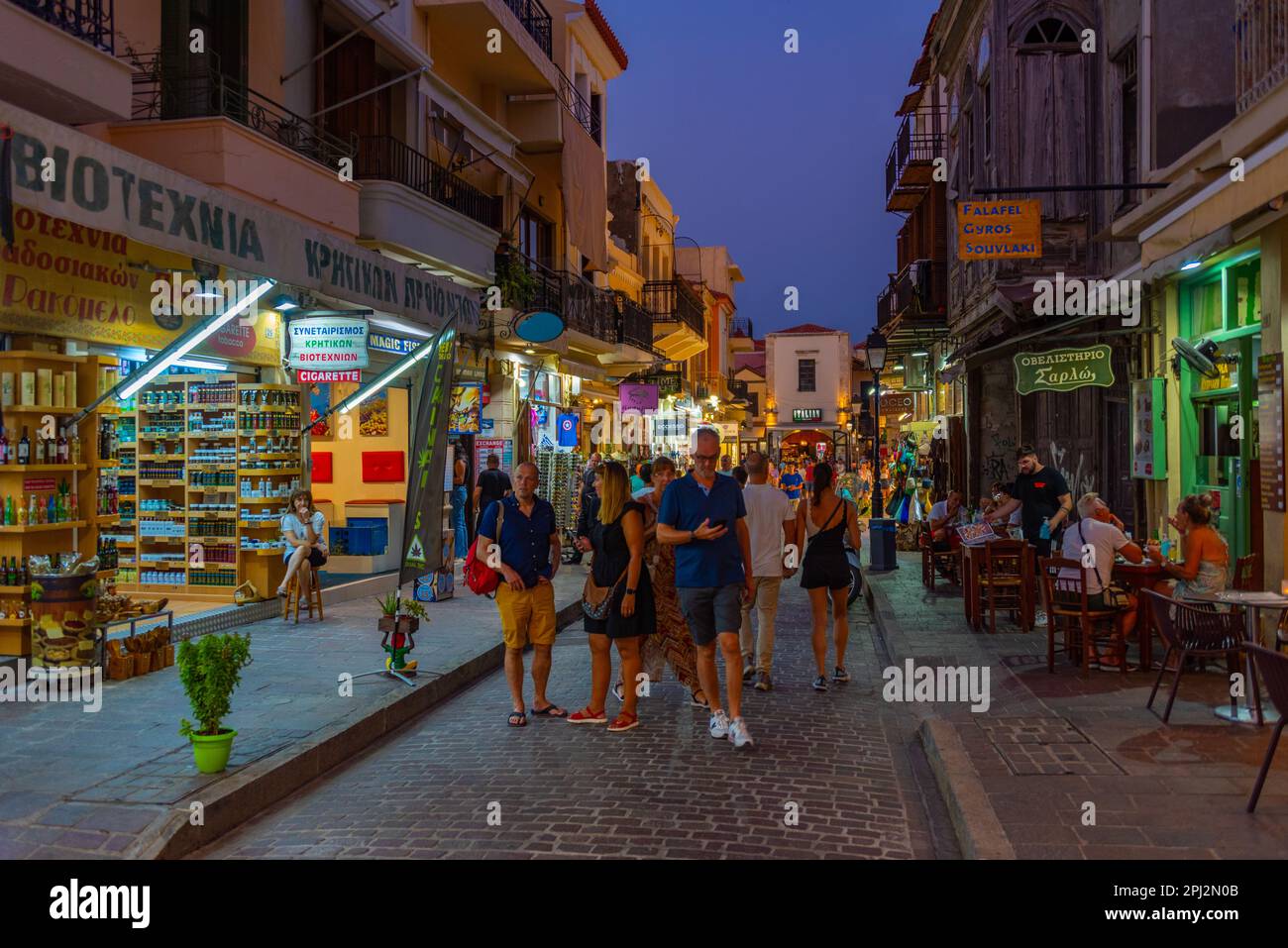 Rethimno, Greece, August 20, 2022: Sunset view of people strolling at a ...
