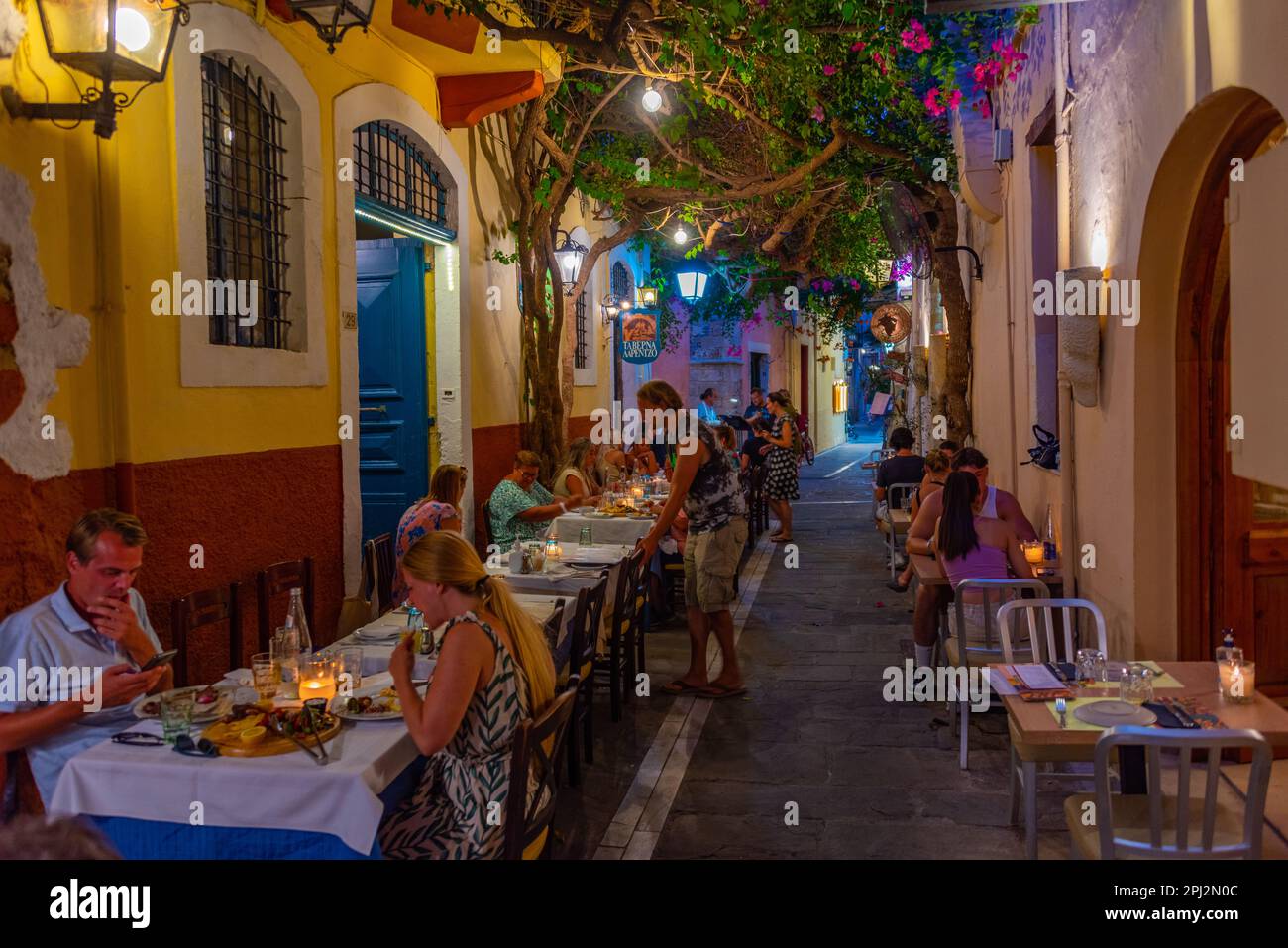 Rethimno, Greece, August 20, 2022: Sunset view of people strolling at a ...