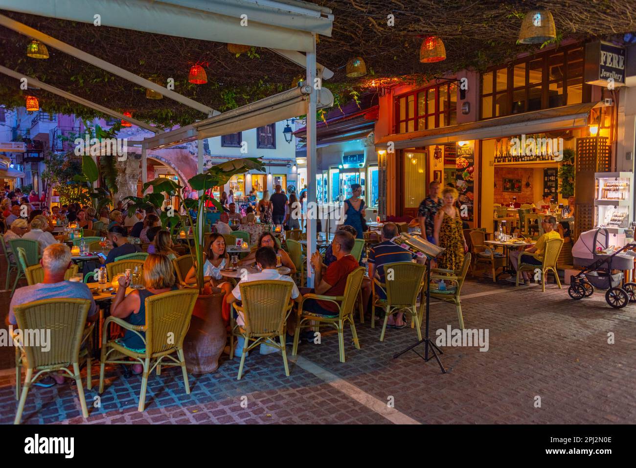 Rethimno, Greece, August 20, 2022: Sunset view of people strolling at a ...