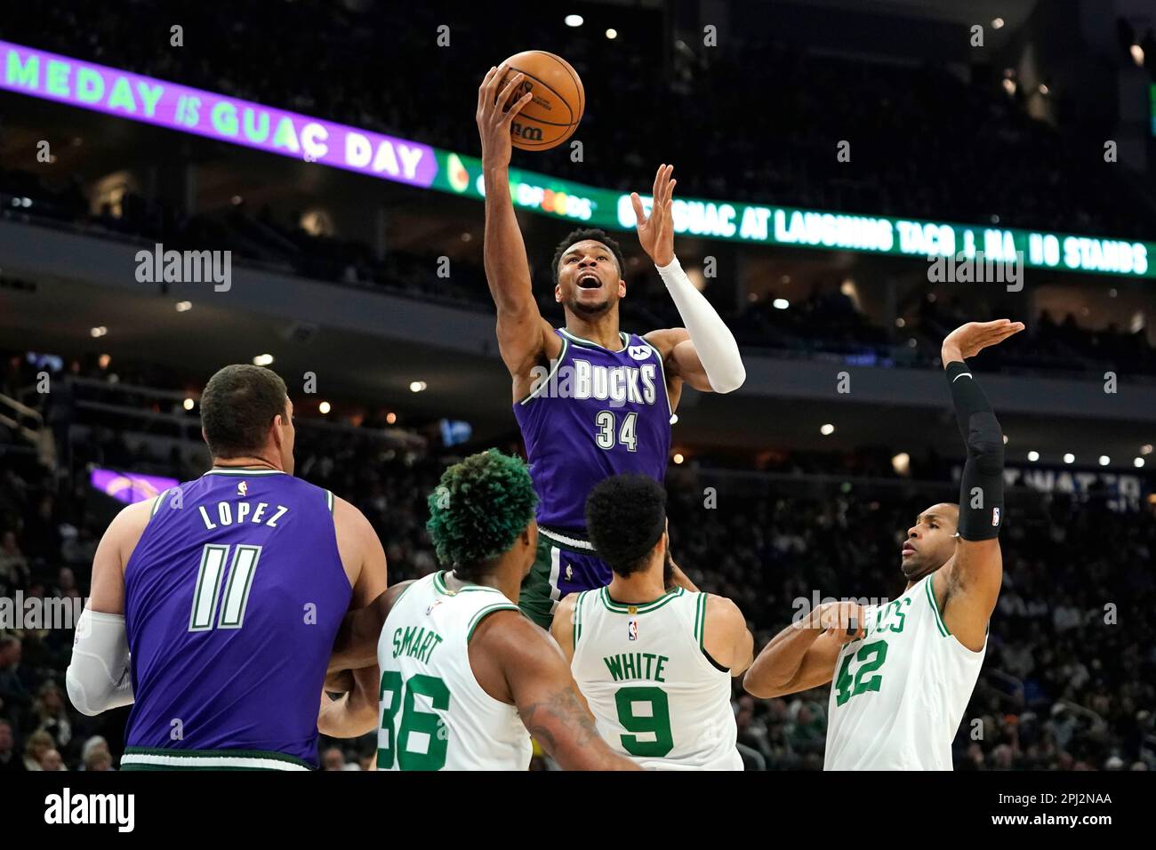 Milwaukee Bucks' Giannis Antetokounmpo (34) shoots over Boston Celtics ...