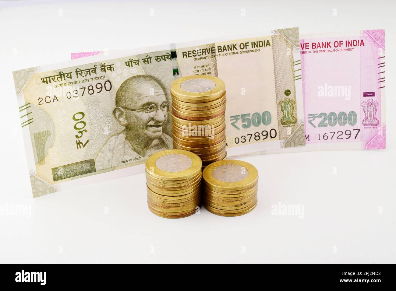 Small amount of indian currency on white background Stock Photo - Alamy